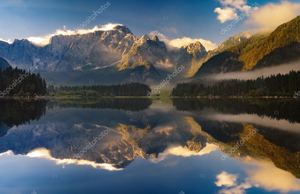 Mountain lake in the Alps — Stock Photo © MikeMareen #128043816