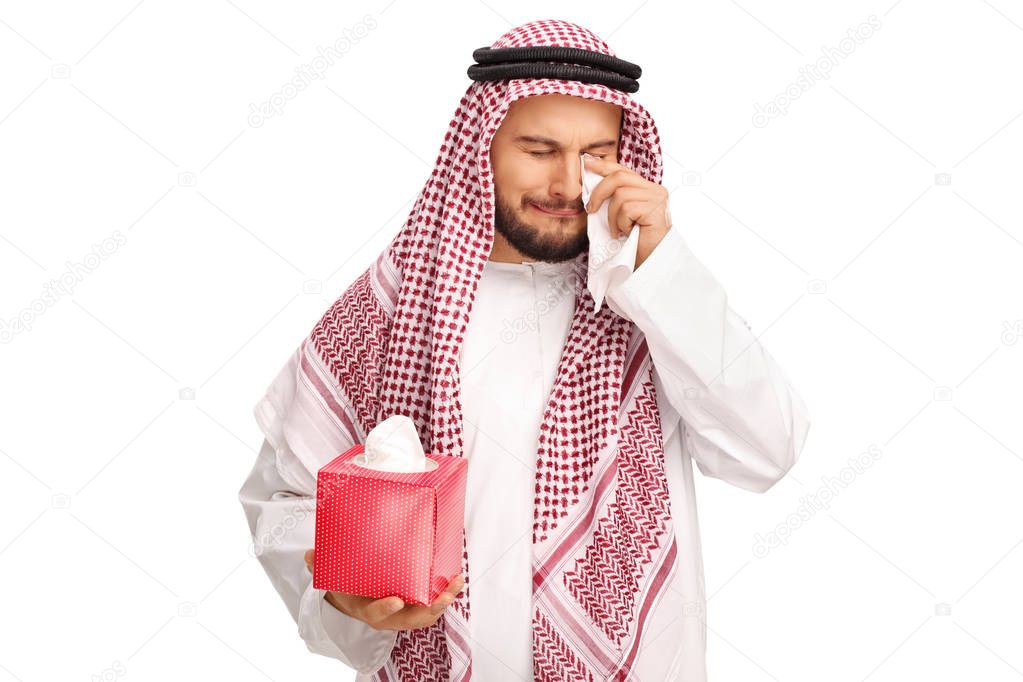 Arabian man crying and wiping his tears with napkins Stock Photo by ...