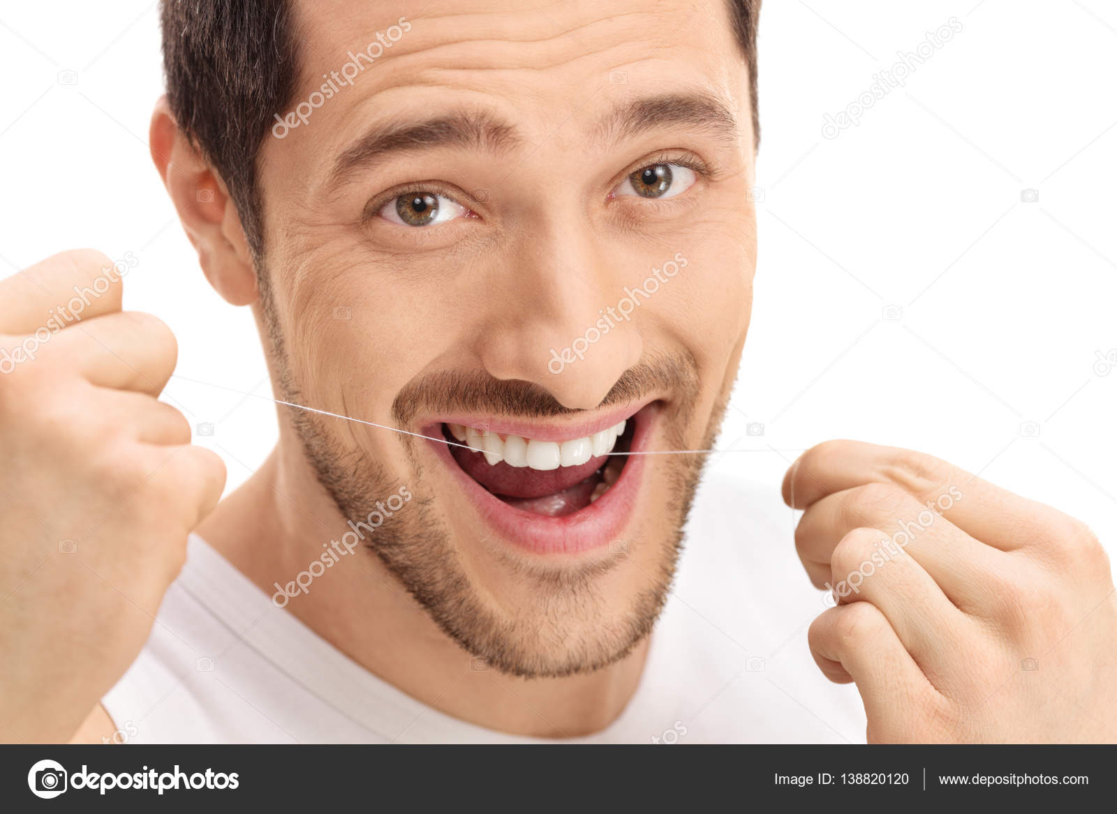 Man flossing his teeth — Stock Photo © ljsphotography #138820120