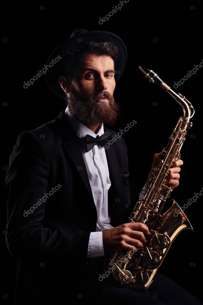 Bearded man with a saxophone — Stock Photo © ljsphotography #150953560