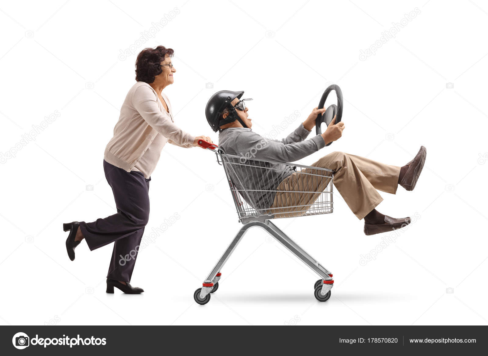 Man riding inside a shopping cart being pushed by woman — Stock Photo ...