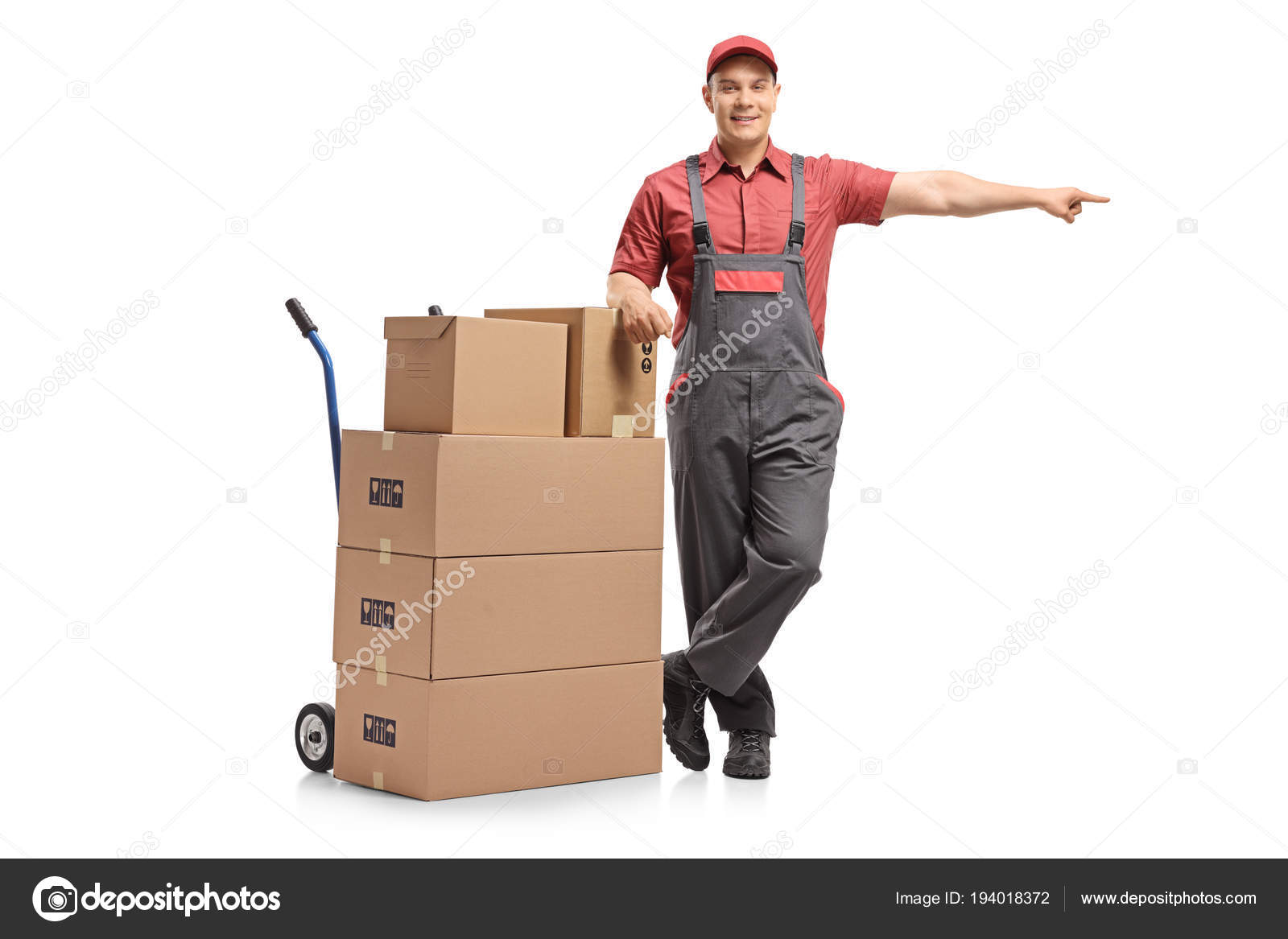 Full Length Portrait Mover Leaning Hand Truck Stack Boxes Pointing ...