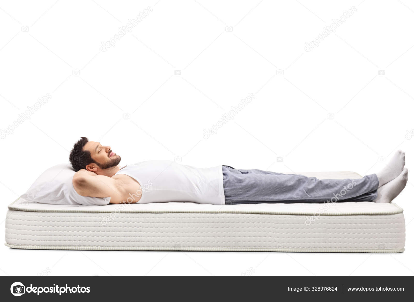 Man in nightwear sleeping on a mattress — Stock Photo © ljsphotography ...