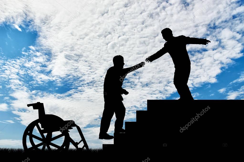 Man gives helping hand to disabled person in wheelchair — Stock Photo ...