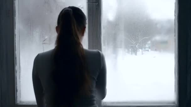 Woman opens a window in winter — Stock Video © Marina1408 #144344763