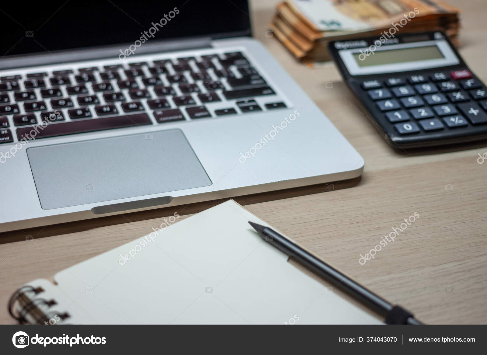 Office table with laptop notebook and cash stack Stock Photo by ...