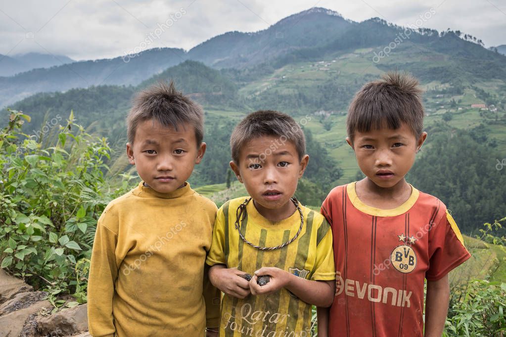 Boys standing with mountains on background — Stock Editorial Photo © NJPhoto #130261786