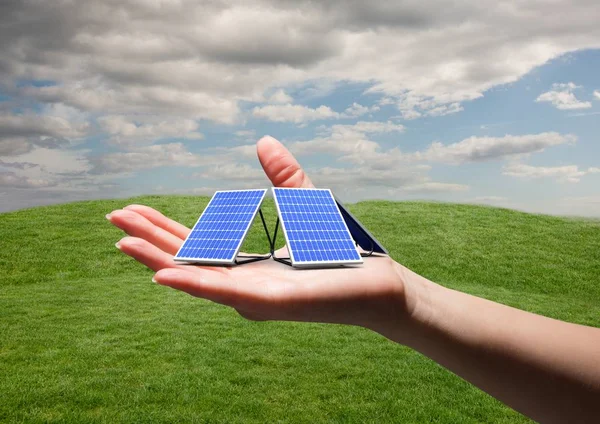 Solar panels on hands. grass back — Stock Photo © vectorfusionart ...