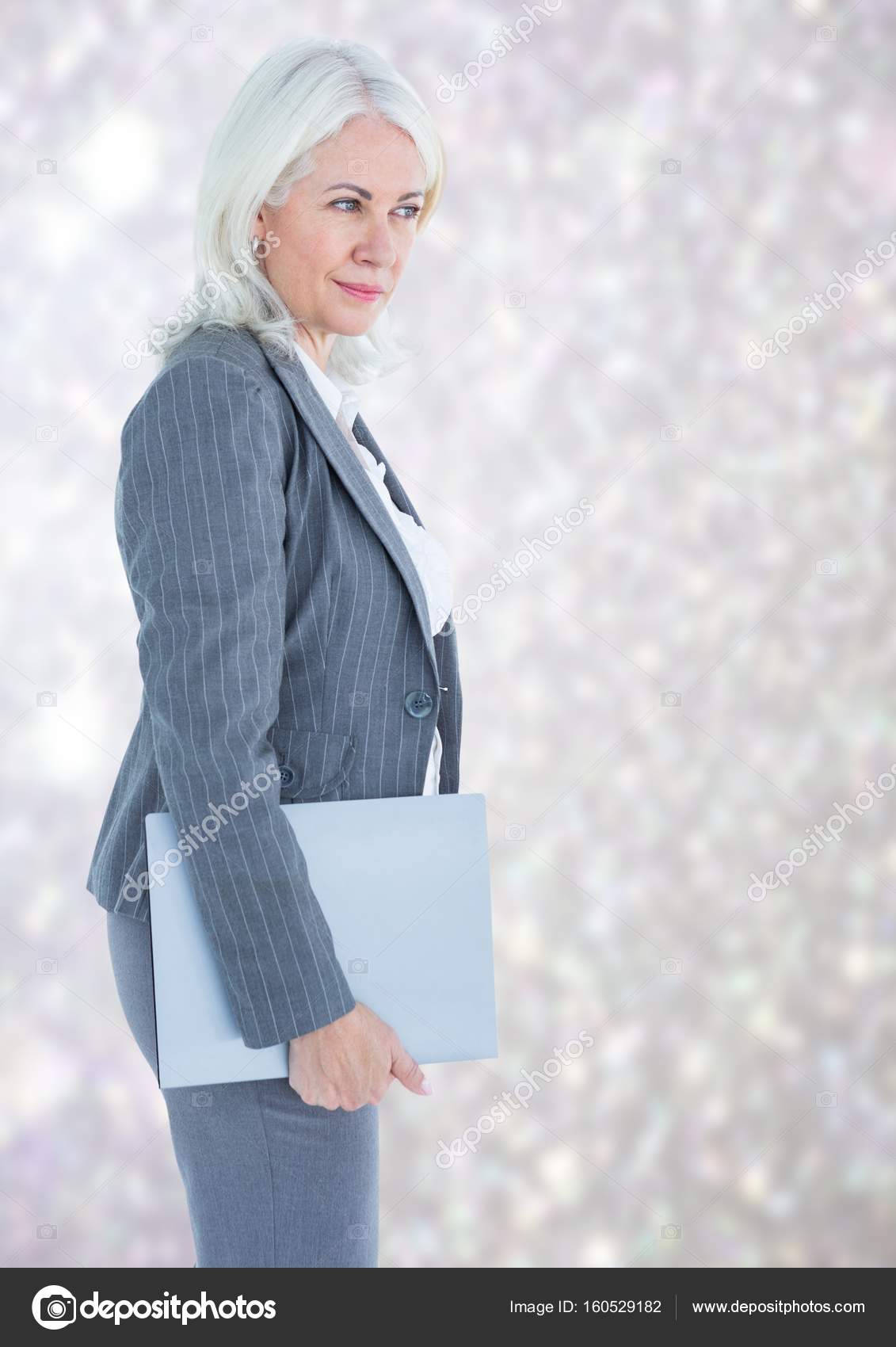 Woman holding files and folders with blurred sparkling background ...