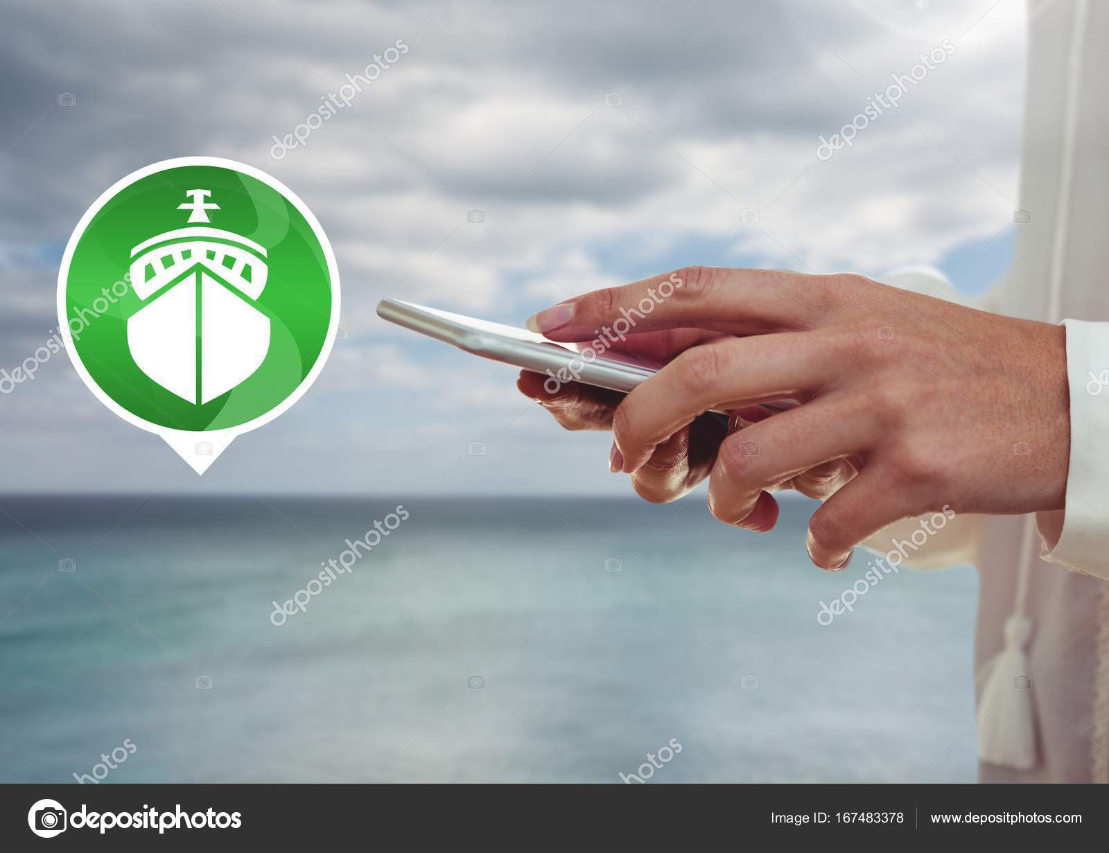 Hand holding phone with ship icon by sea Stock Photo by ...