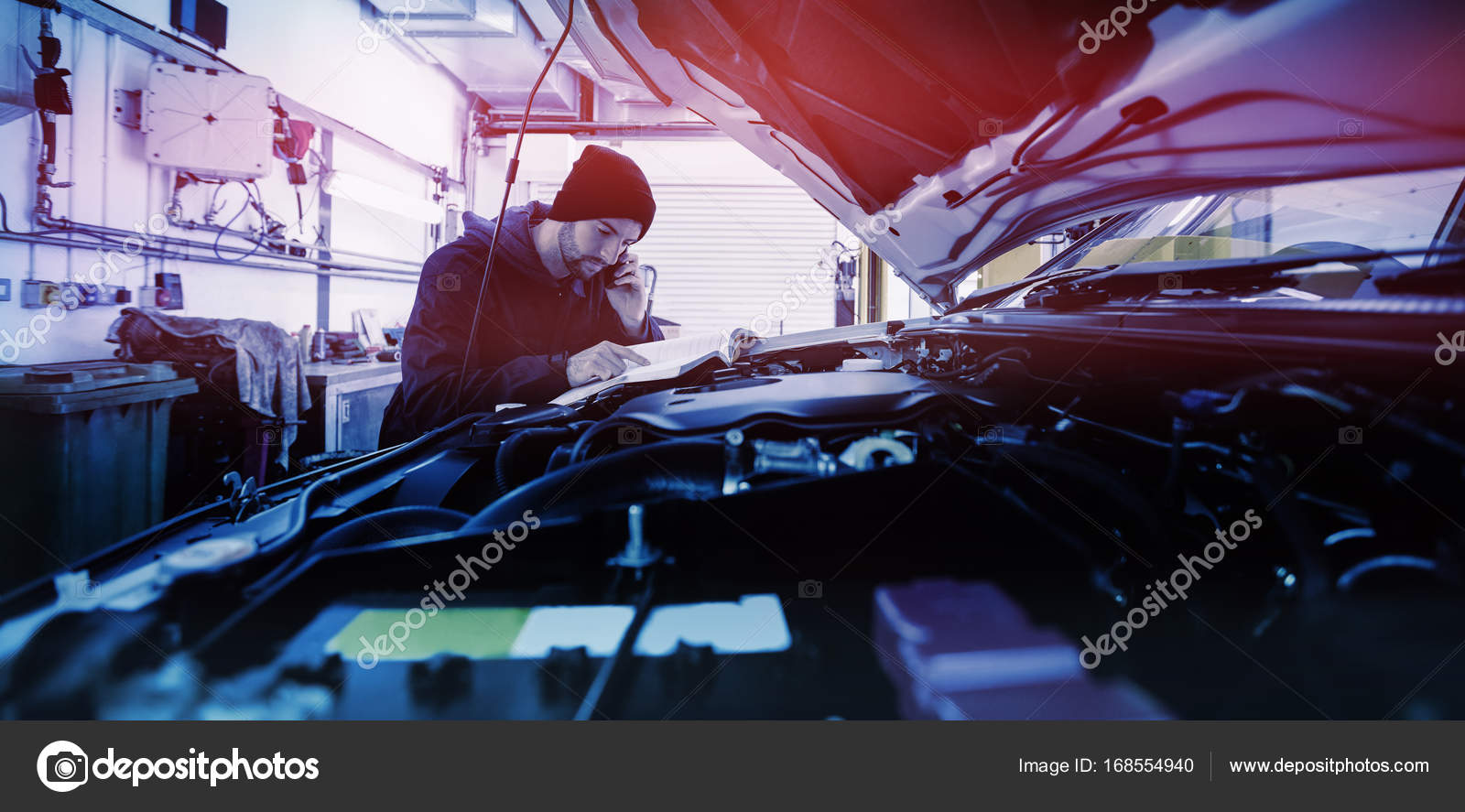 Mechanic watching the car engine Stock Photo by ©vectorfusionart 168554940
