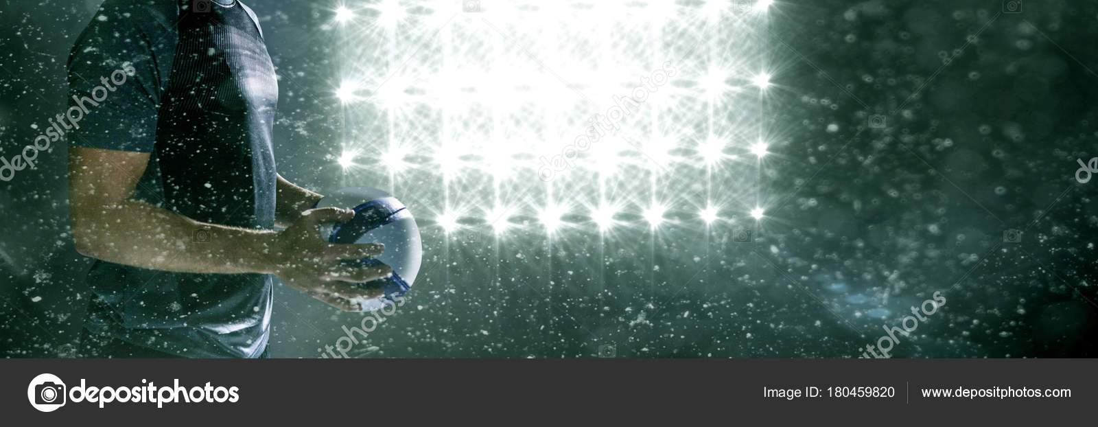 Rugby Player Thinking While Holding Ball Spotlights Stock Photo by ...