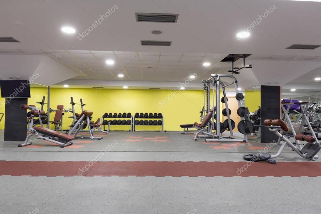 Interior of a gym with equipment — Stock Photo © rilueda #184381538