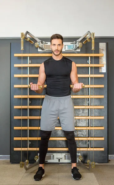 Full body cable pulley machine workout in the gym Stock Photo by ...