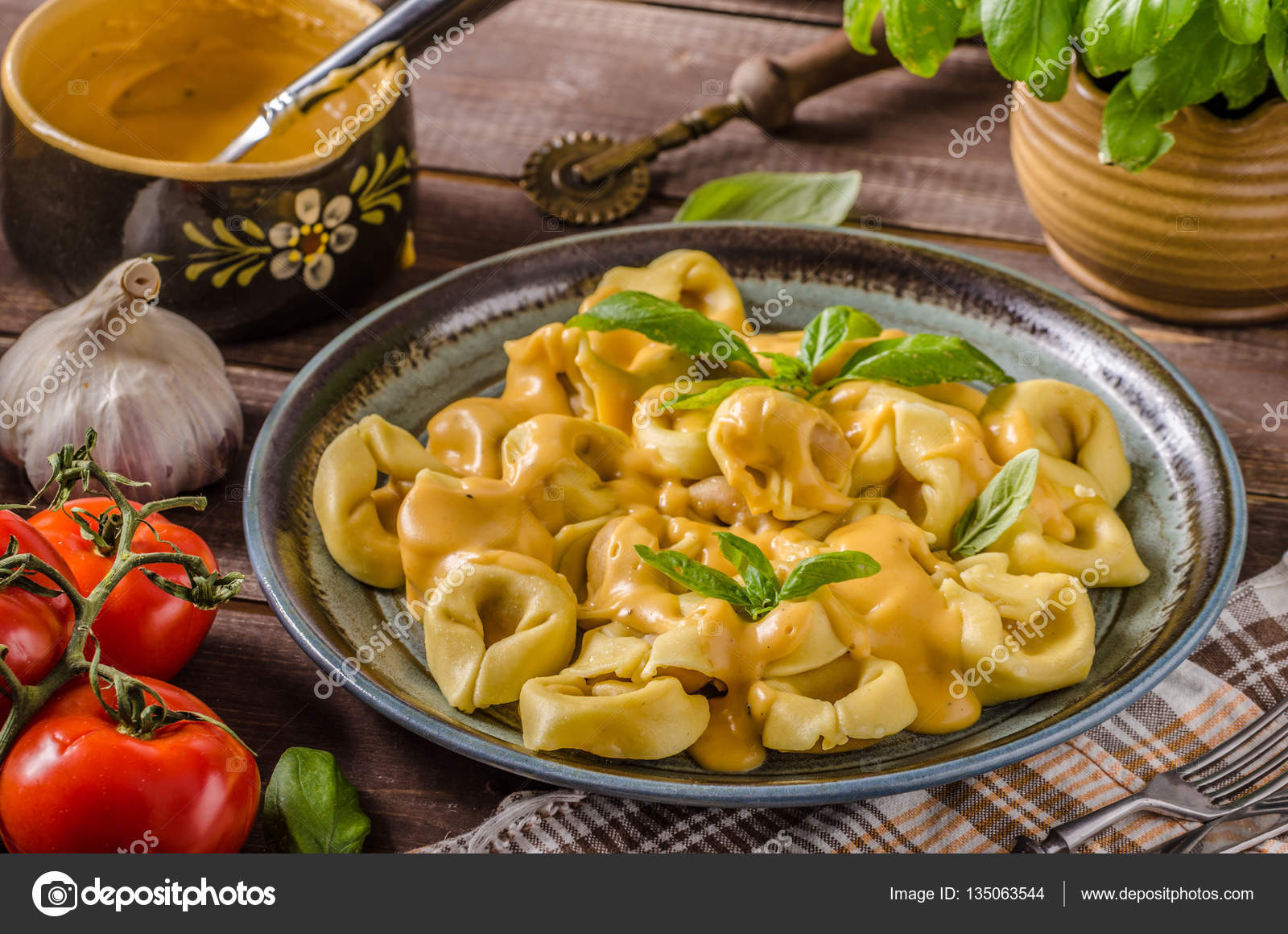 Tortellini with cheese sauce Stock Photo by ©Peteer 135063544