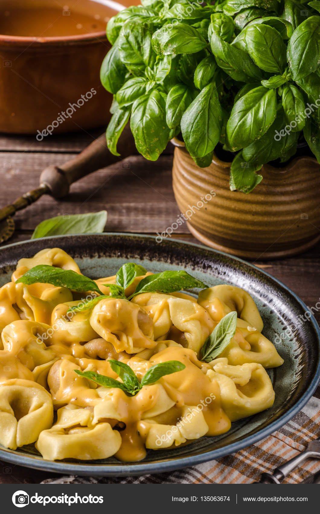 Tortellini with cheese sauce Stock Photo by ©Peteer 135063674