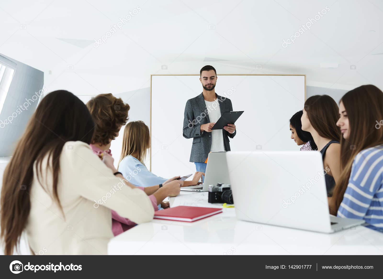 Talented male IT programmer making presentation of new software ...