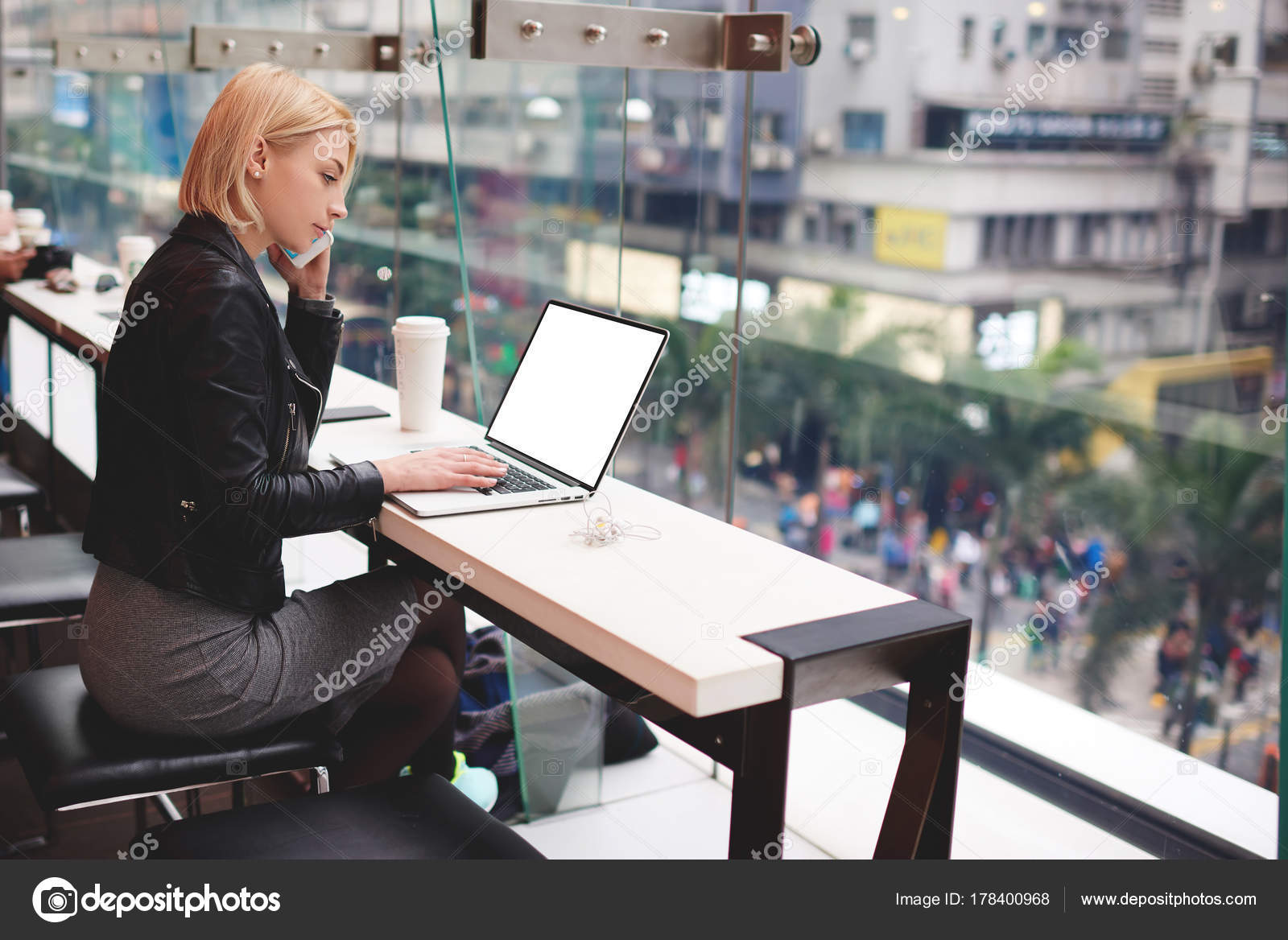 Woman freelancer using modern laptop computer with mock up screen ...