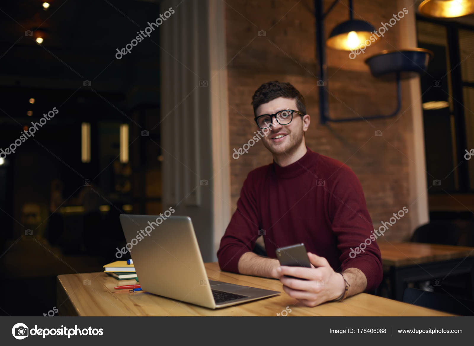 Male student learning using modern technology for preparing homework ...