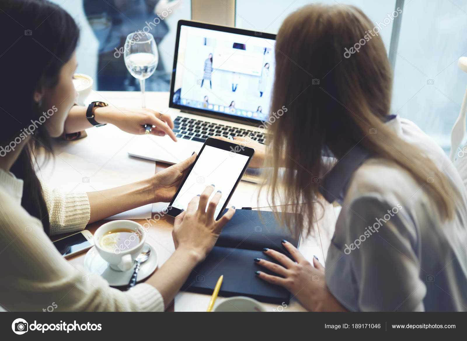 Rear View Female Designers Using Technology Updating Information Web ...