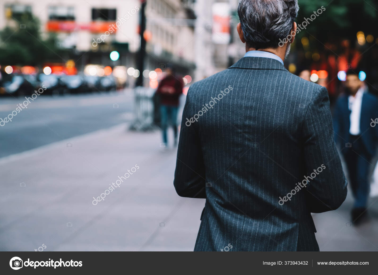 Man In Suit Walking Back View