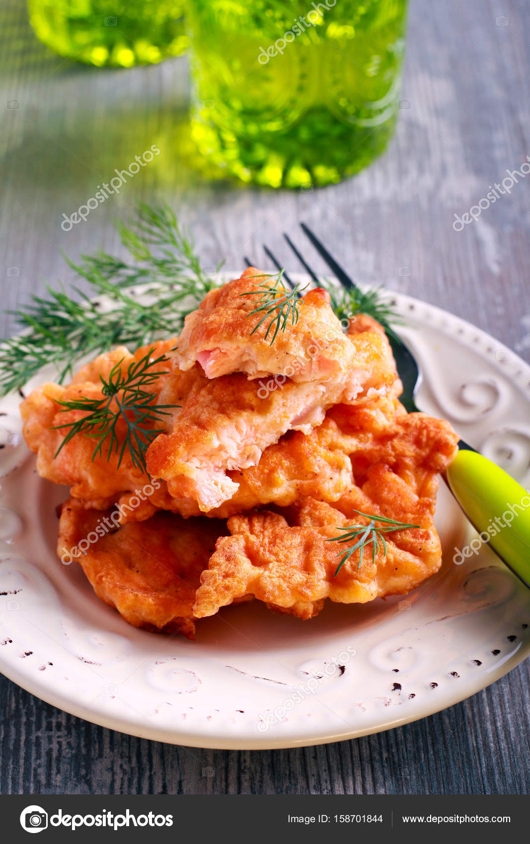 Salmon fish fritters on plate Stock Photo by ©manyakotic 158701844