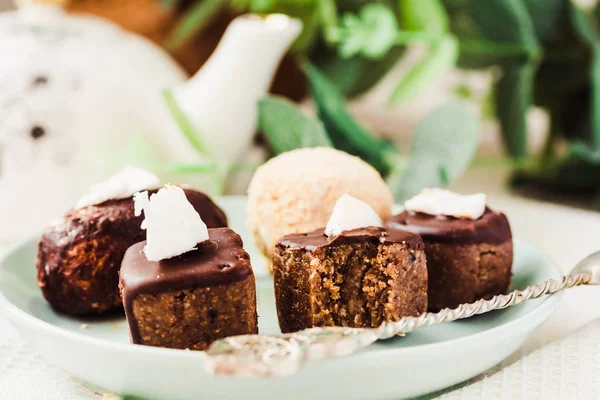 Raw chocolate candy with nuts and coconut, healthy vegan dessert ...