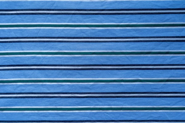 cloth pattern made of thin black, white and green stripes on blue ...