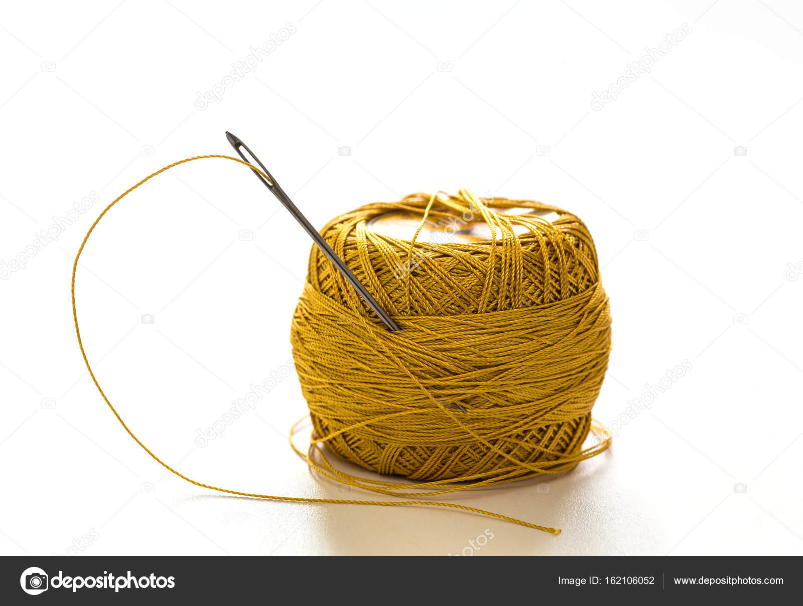 Sewing thread and needle Stock Photo by ©arcadi1962 162106052