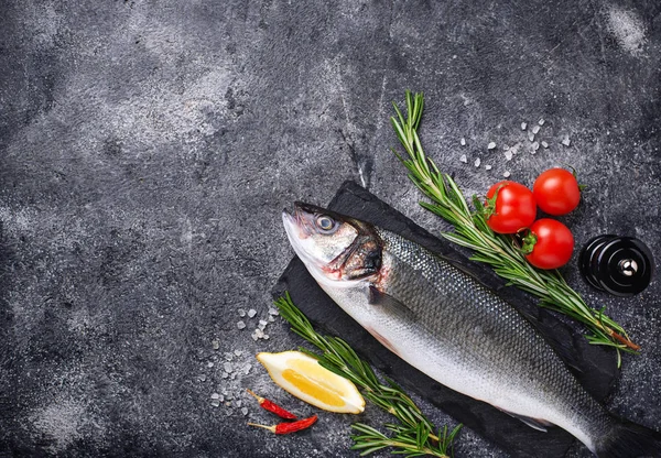 Raw fish seabass with condiments - Stock Image - Everypixel