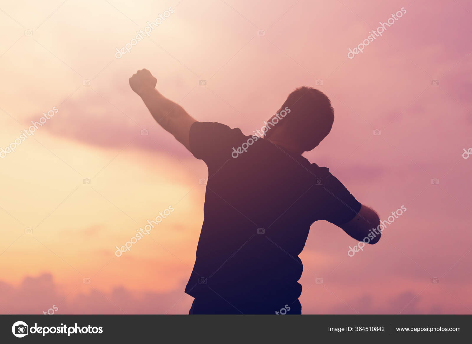 Silhouette Man Hands Raised Sunset Empowered Concept Stock Photo by ...