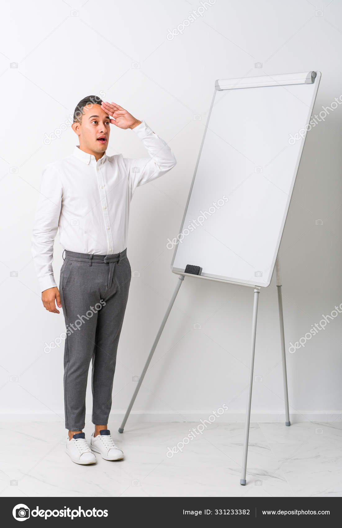 Young Latin Coaching Man Whiteboard Isolated Looking Far Away Keeping ...