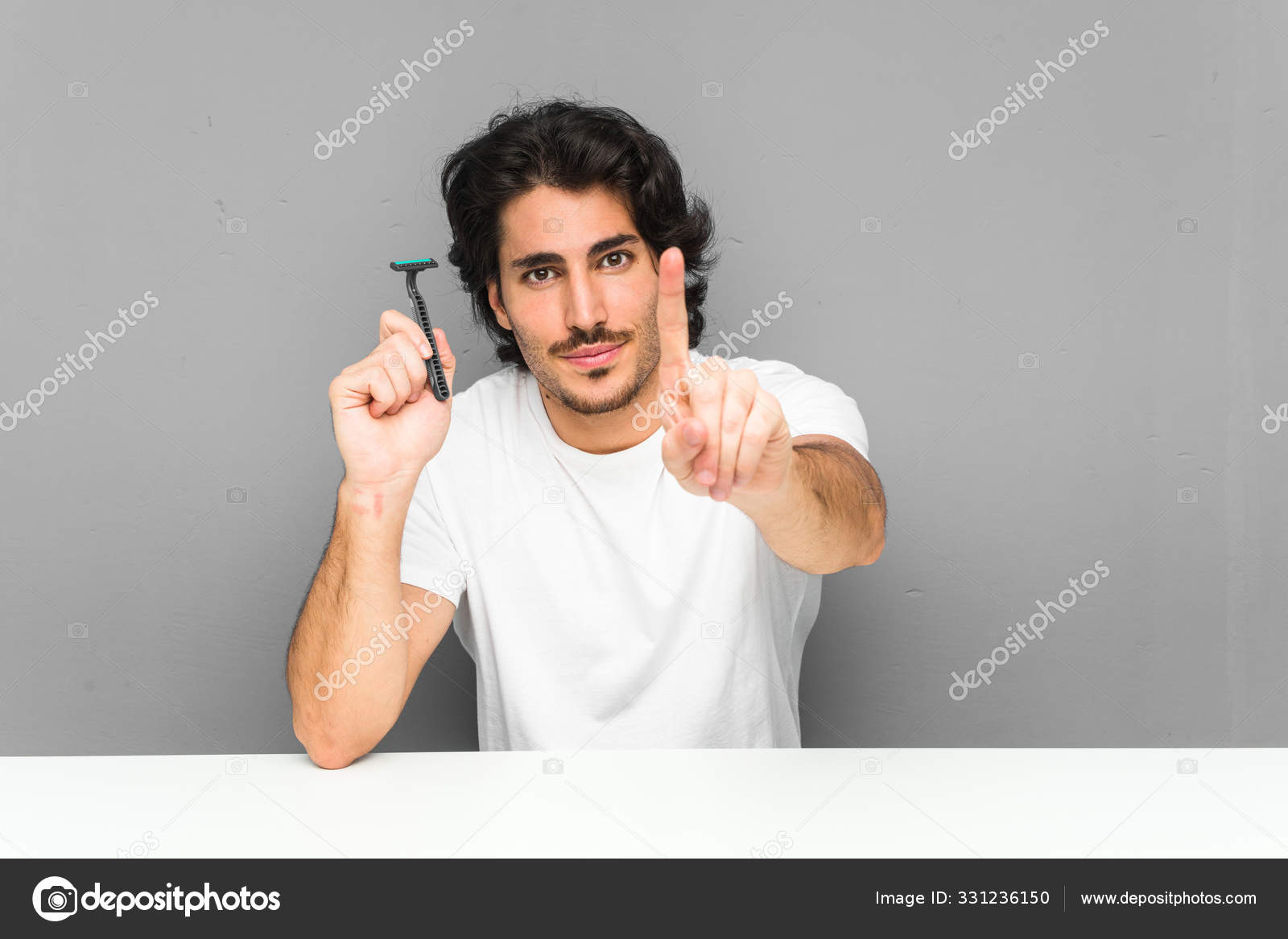 Young Man Holding Razor Blade Showing Number One Finger — Stock Photo ...