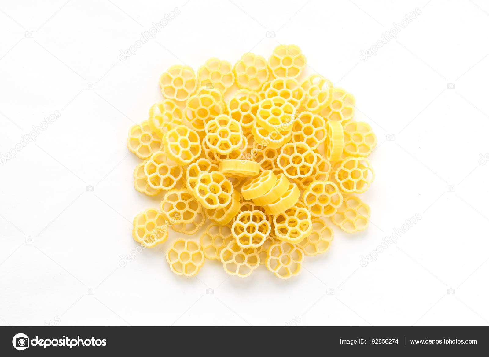 Macaroni ruote background with pasta on white isolated background with ...