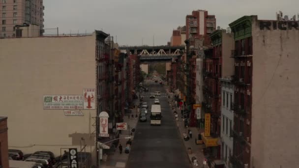 AERIAL: Low flight through Chinatown, New York City street with Chinese ...