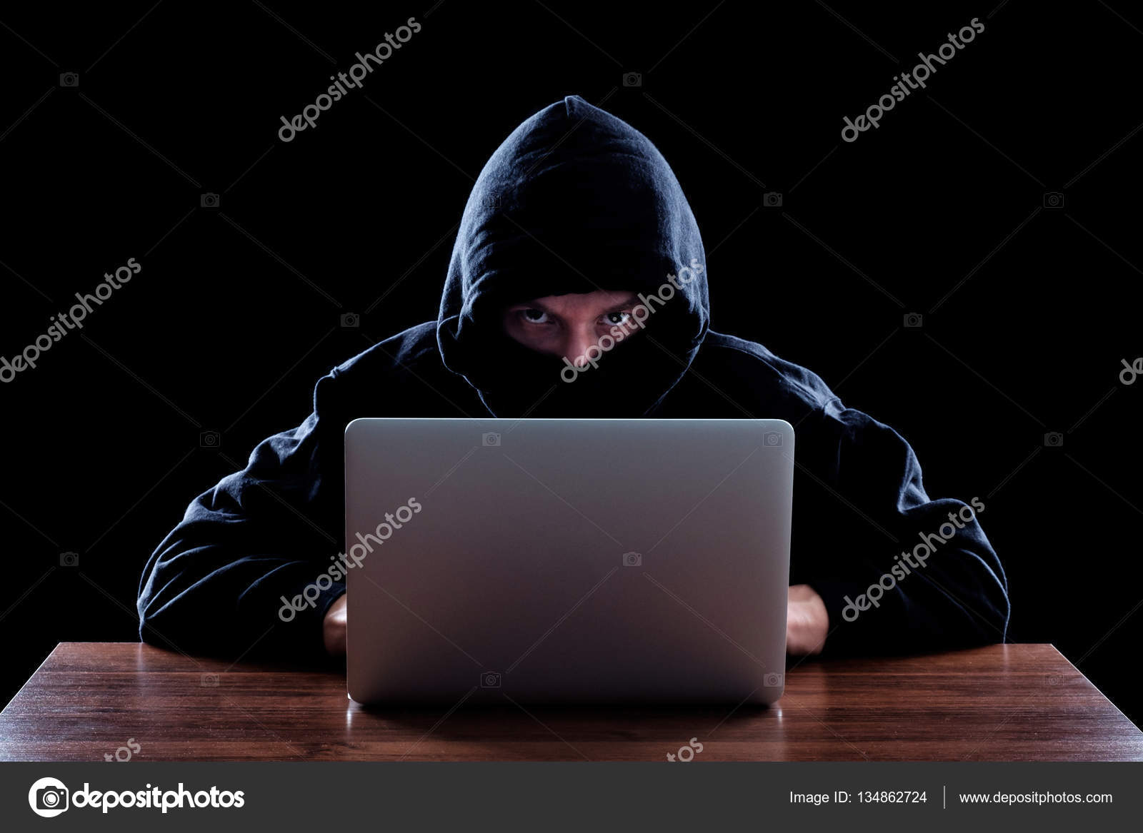 Hooded computer hacker stealing information Stock Photo by ... Hooded computer hacker stealing information Stock Photo by ...