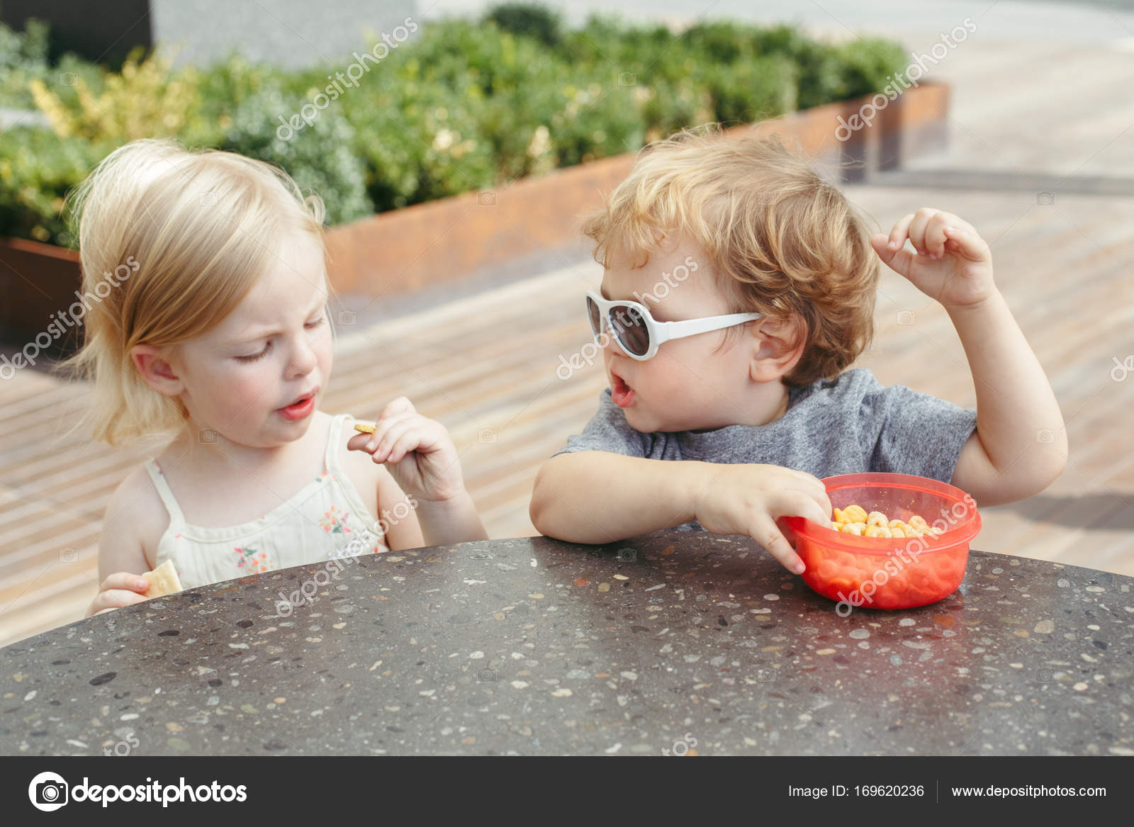 Toddlers sharing food Stock Photo by ©AnoushkaToronto 169620236