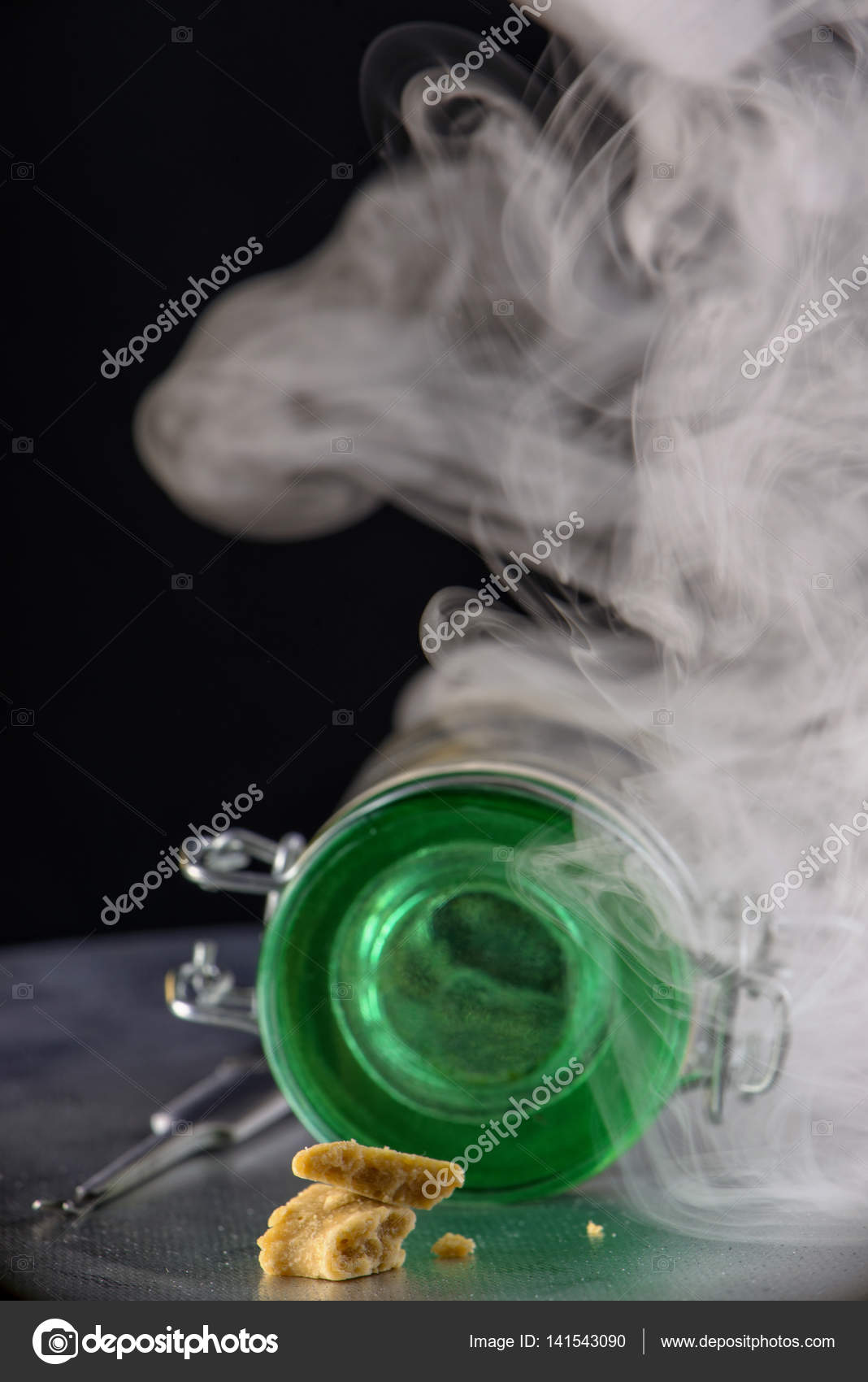 Marijuana extraction concentrate aka wax crumble on smoky backgr ⬇ ...