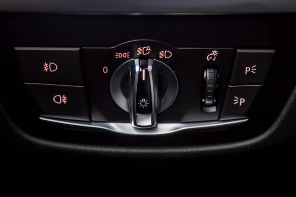 close-up of Headlights control unit with buttons for controlling ...