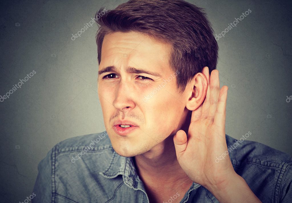 Hard of hearing man placing hand on ear asking someone to speak up ...