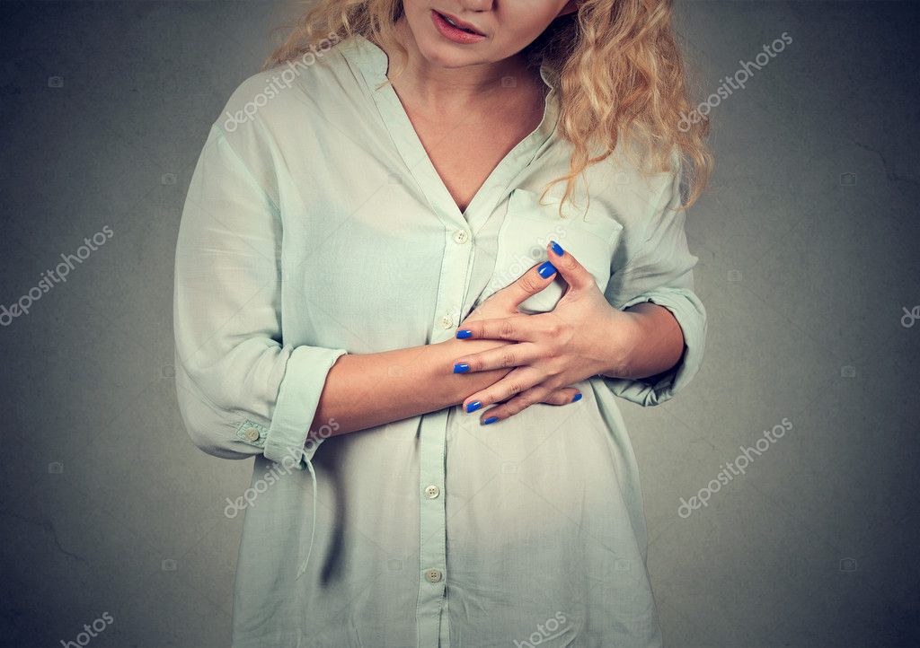 Sick woman with heart attack, pain touching her chest with hands ...