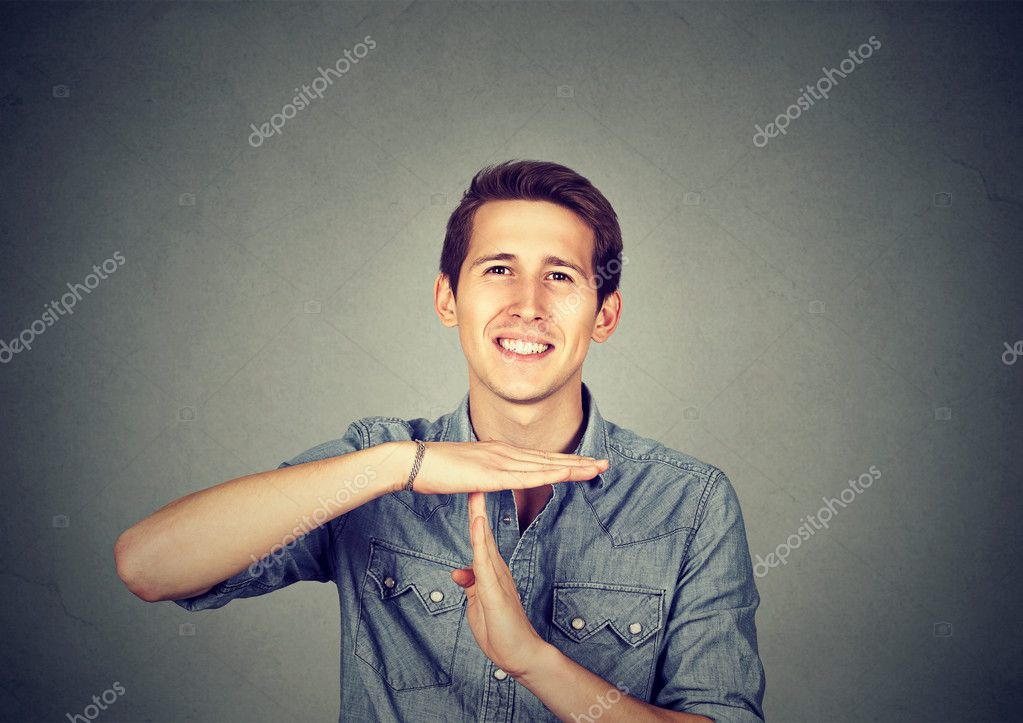 Happy man giving time out hand gesture — Stock Photo © SIphotography ...