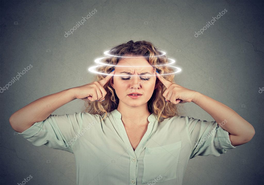 Woman with vertigo. Female patient suffering from dizziness Stock Photo ...