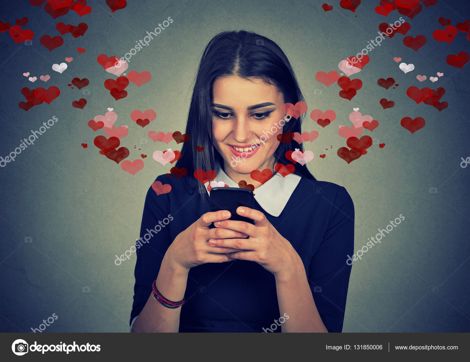 Woman sending love message on mobile phone hearts flying away — Stock ...