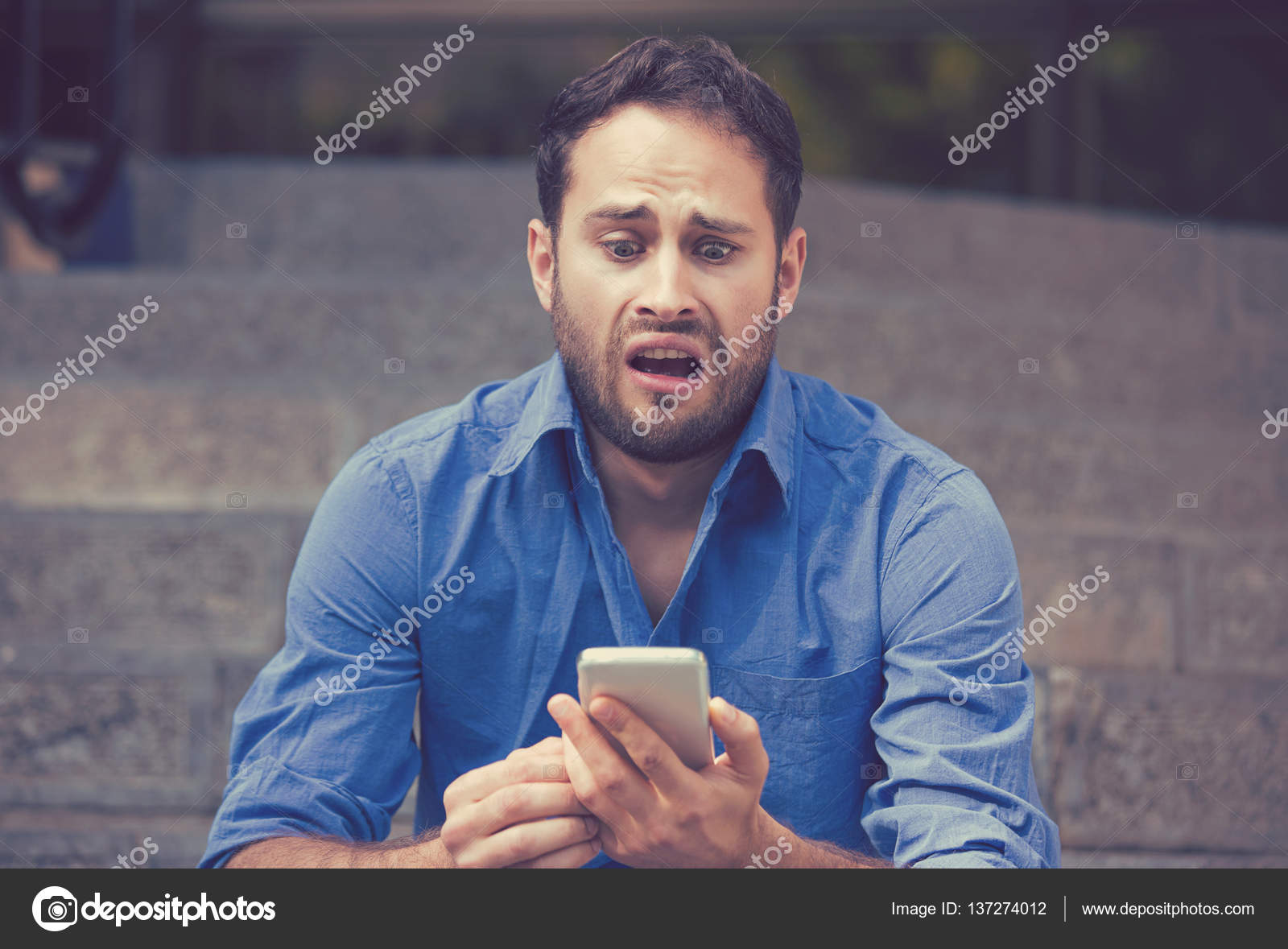 Anxious upset scared man looking at phone seeing bad news — Stock Photo ...