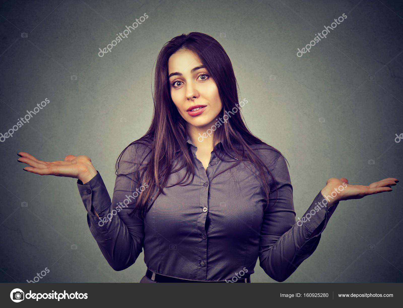 Dumb looking woman arms out shrugs shoulders Stock Photo by ...