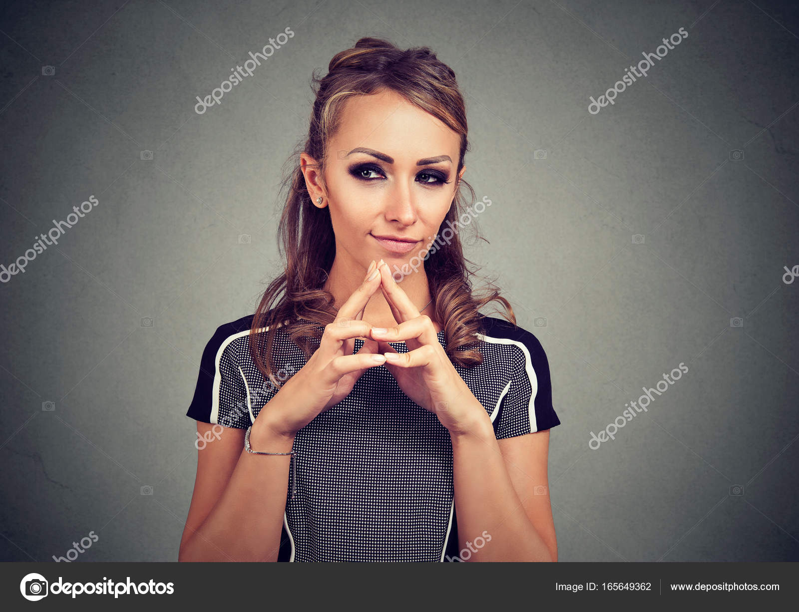 Sly, scheming woman plotting something Royalty Free Photo, Stock Image ...