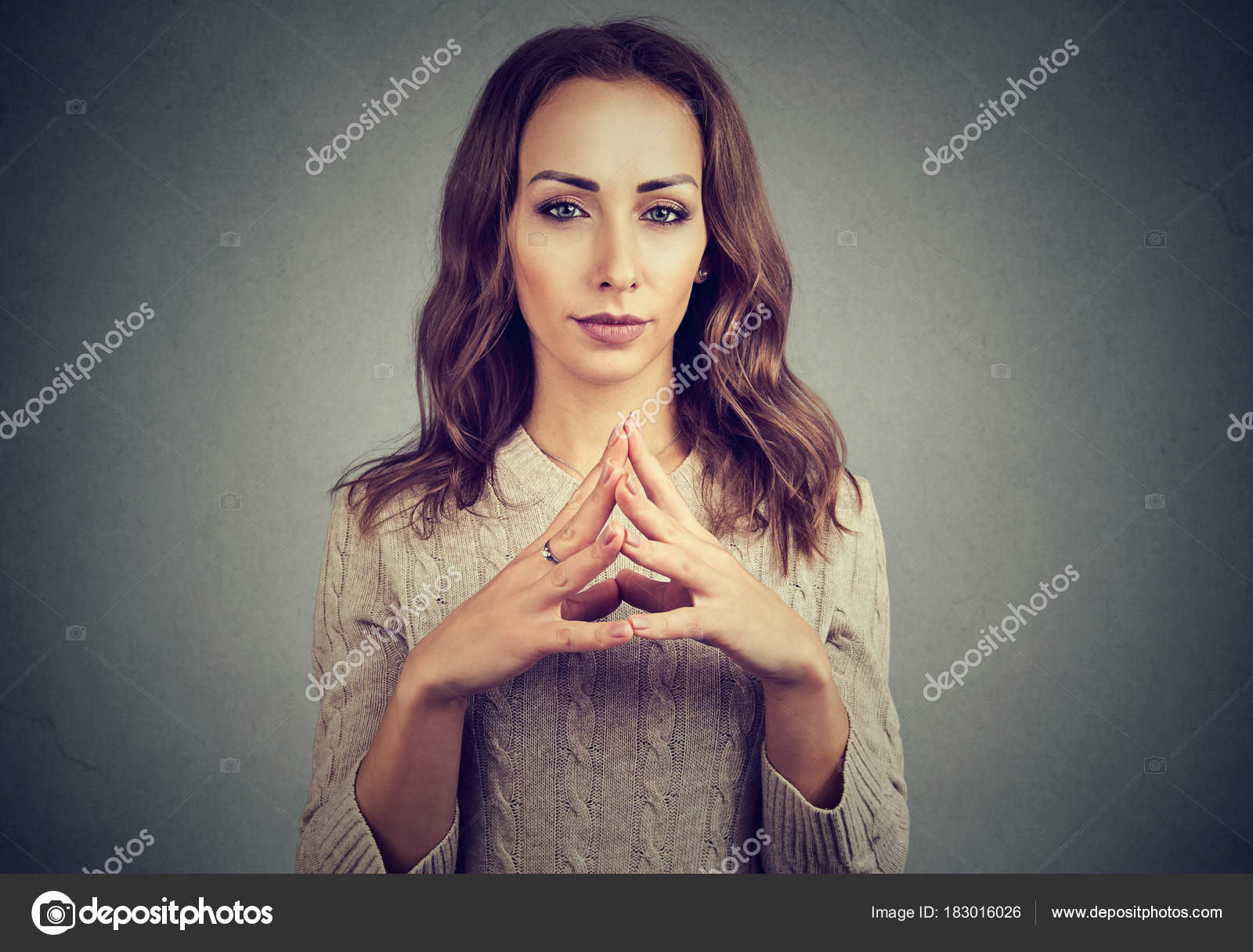 Jealousy woman plotting and posing on gray Stock Photo by ...
