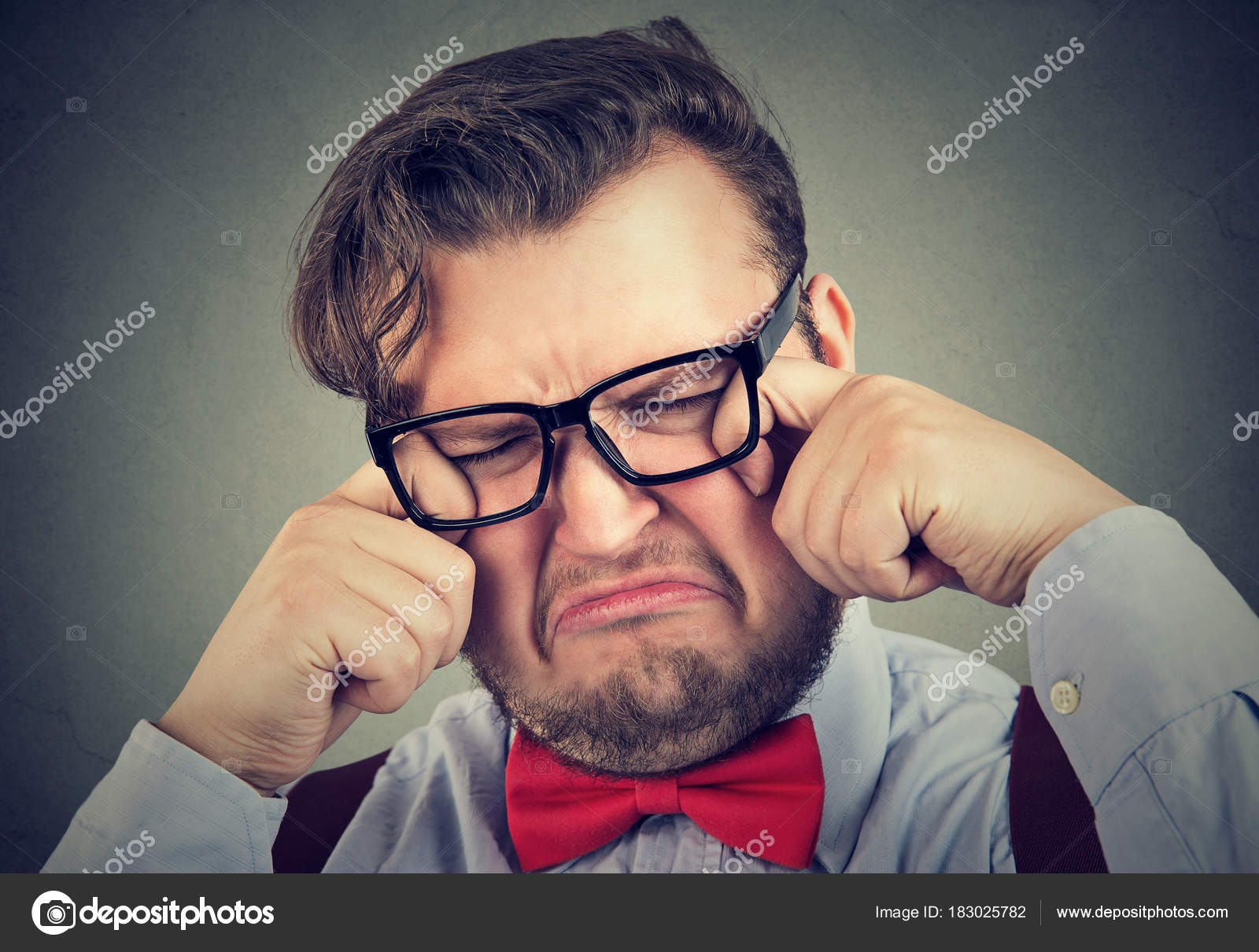 Crying capricious man on gray — Stock Photo © SIphotography #183025782