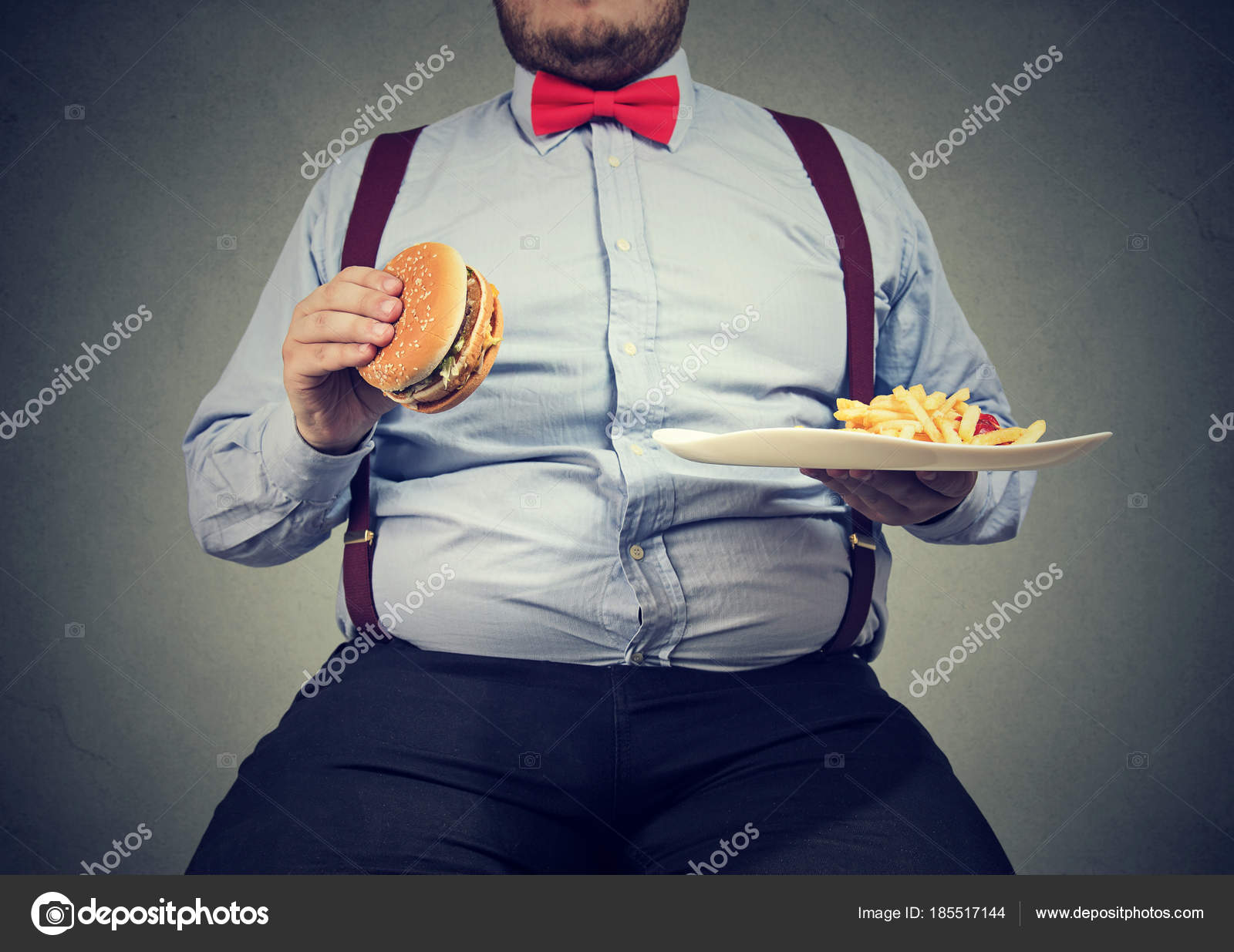 Obese man eating fast food — Stock Photo © SIphotography #185517144